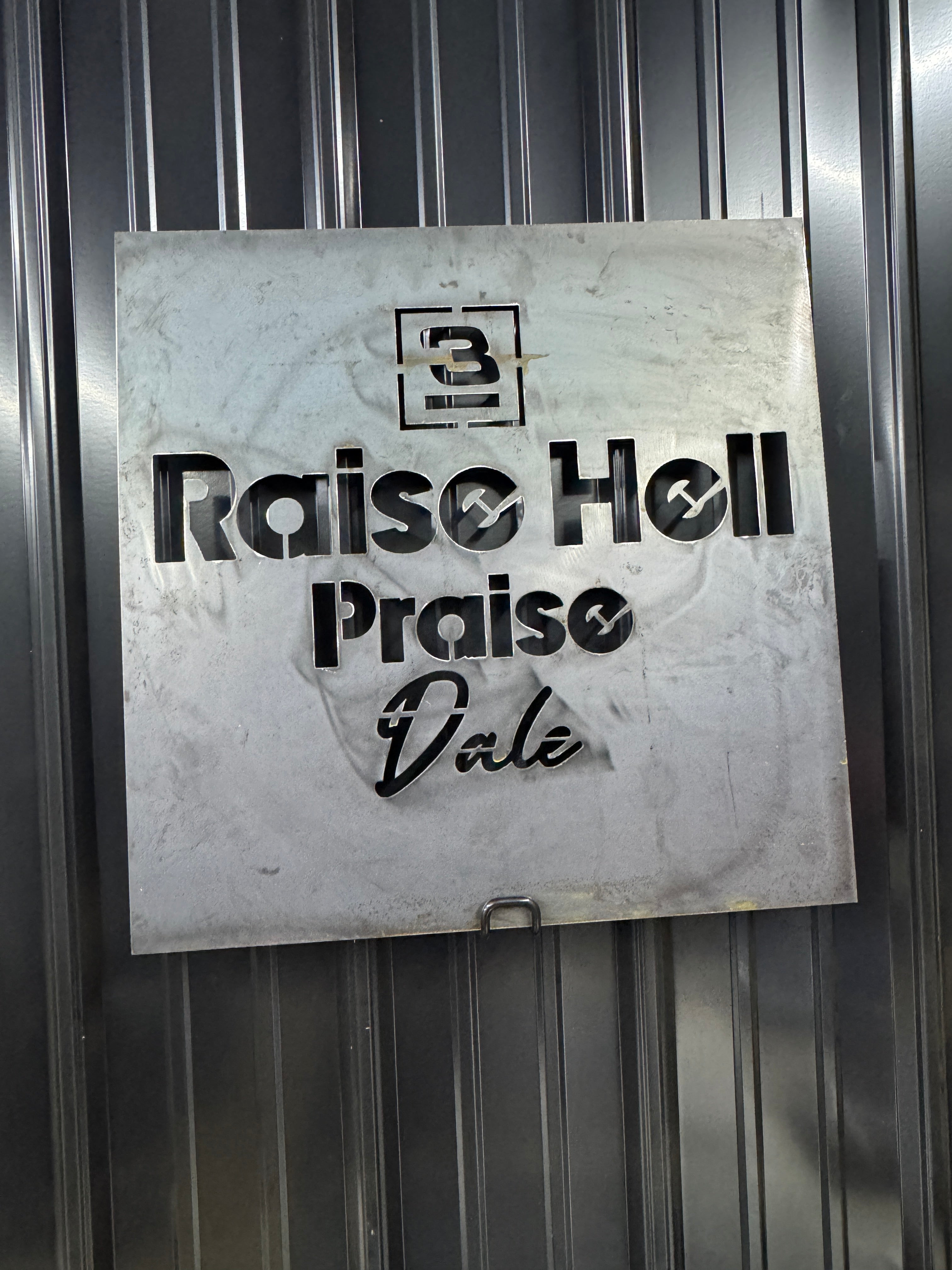 Raise Hell Praise Sign – Ironwood Garage